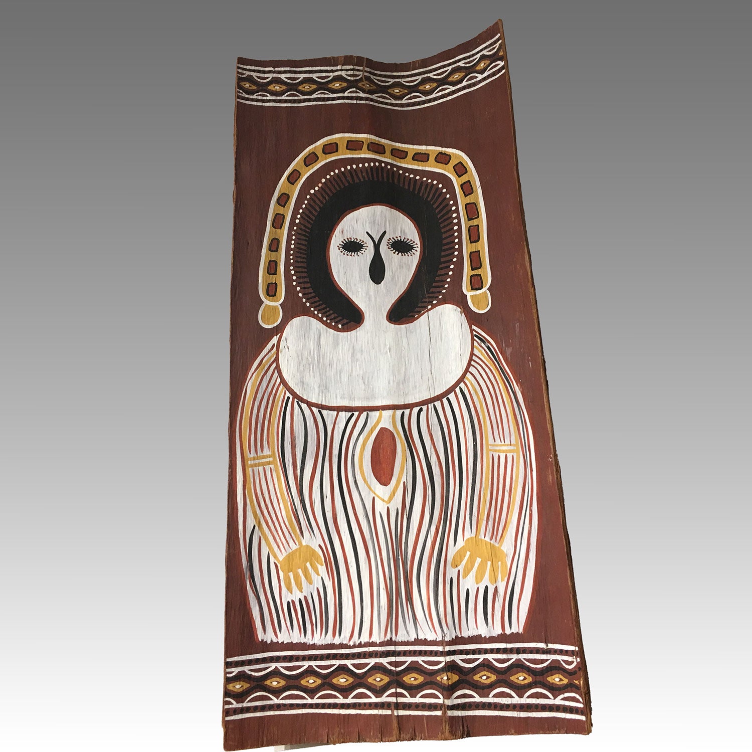 An Australian Aboriginal Wandjina Figure on Bark Panel, early 20th cen