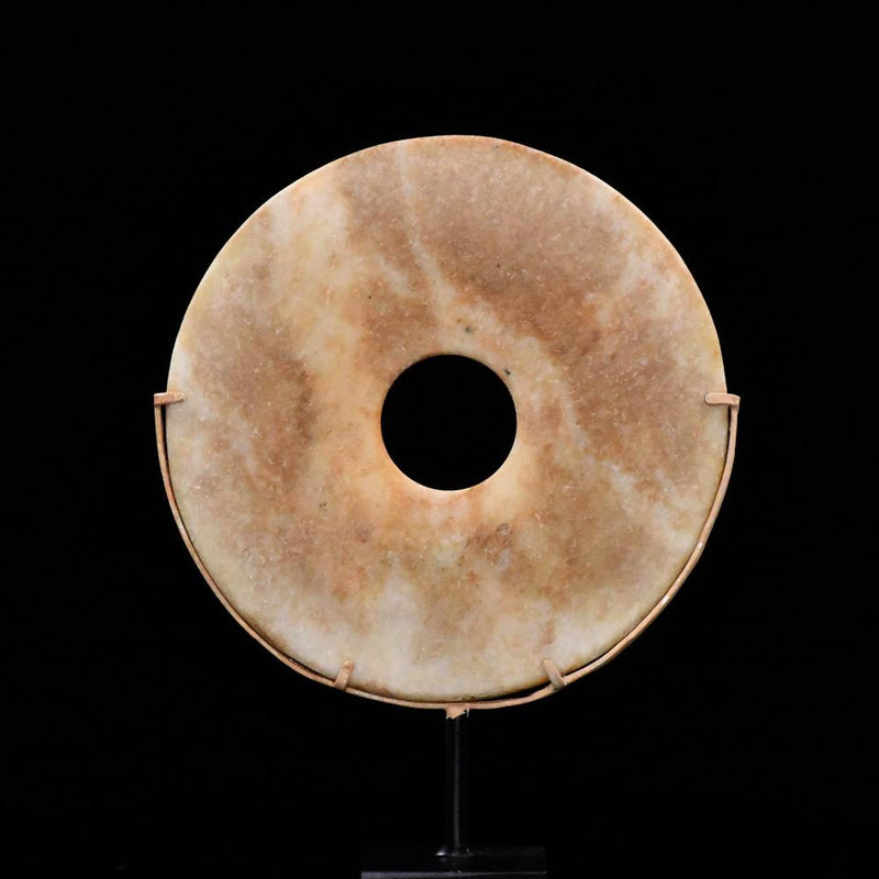 A Chinese Mottled Nephrite Jade Bi Disc, Late Neolithic Period, ca. 30